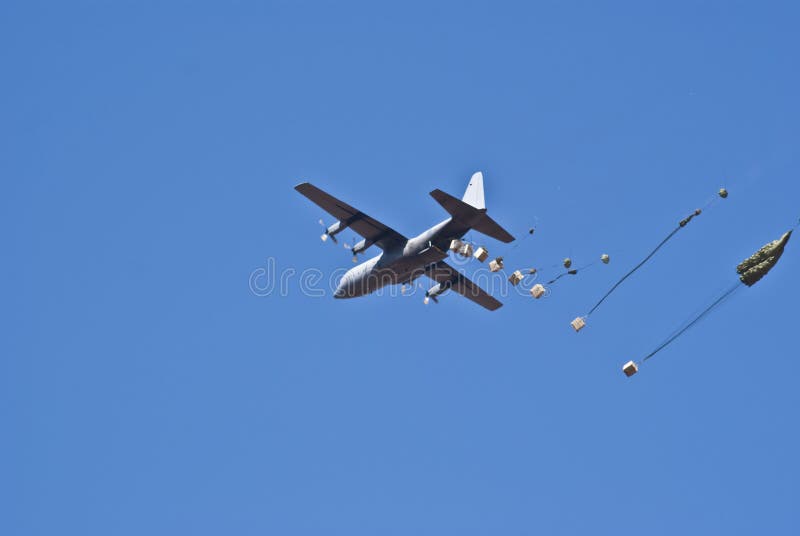 Cargo Plane Dropping Supplies Stock Photo - Image of perspective, boxes ...