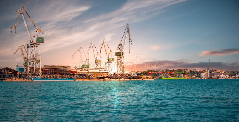 Cranes in the port of Pula editorial photography. Image of shipping ...