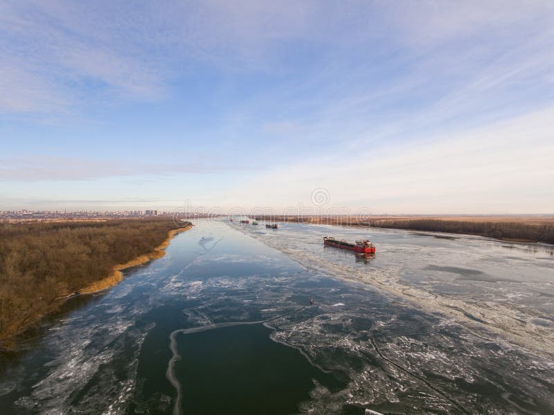 Cargo Ship in Beautiful Frozen River. Stock Photo - Image of ship, reed ...
