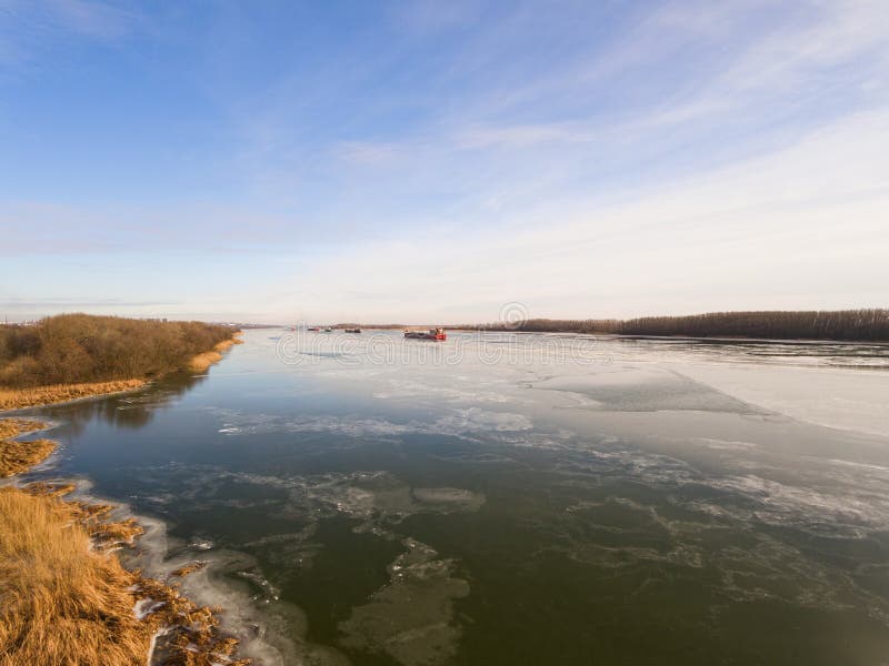 Cargo Ship in Beautiful Frozen River. Stock Photo - Image of drone ...