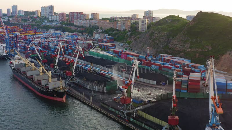 Cargo Ship and a Bulk Carrier, Standing at the Quay Wall, are Loaded in ...