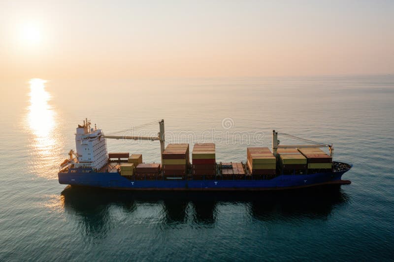 Cargo Ship with Containers in the Open Sea at the Sunset, Aerial Drone ...