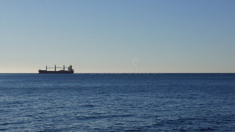 Cargo Ship on the Distant Horizon Stock Photo - Image of nature ...