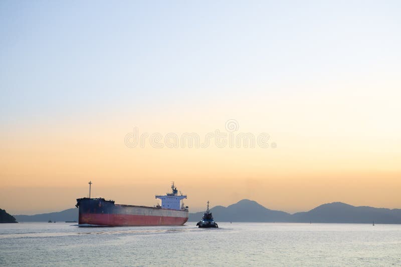 Cargo Ship Entering the Port of Santos while a Tugboat Accompanies ...