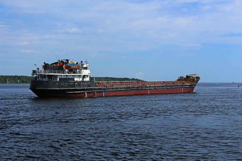 Freighter in the sea stock image. Image of coastline - 124565693