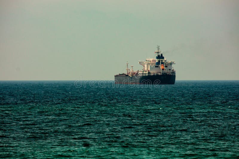 Distant Cargo Ship 2 stock image. Image of boat, move - 116219407