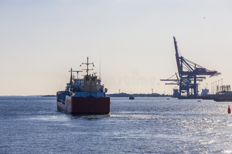 Cargo Ship on Its Way To the Open Sea from a Port Stock Photo - Image ...