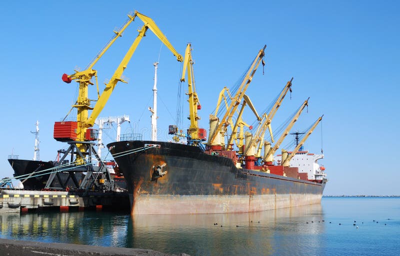 Cargo ship on loading stock image. Image of ocean, pier - 5678585