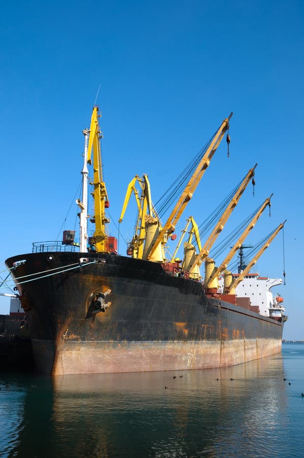 Cargo ship on loading stock image. Image of cargo, dock - 5678585