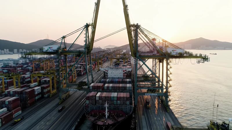 Cargo Ship Loading Containers at Port Terminal with Sunset High Angle ...