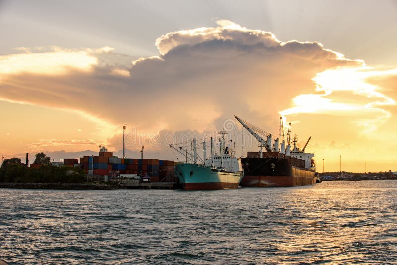Cargo Ship Loading Containers at Sunshine Stock Image - Image of ...