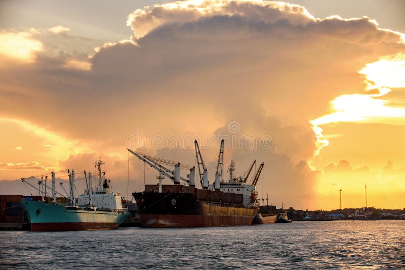 Cargo Ship Loading Containers at Sunshine Stock Image - Image of sunset ...