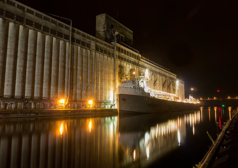 Cargo ship at night stock image. Image of shipload, landing - 34559559