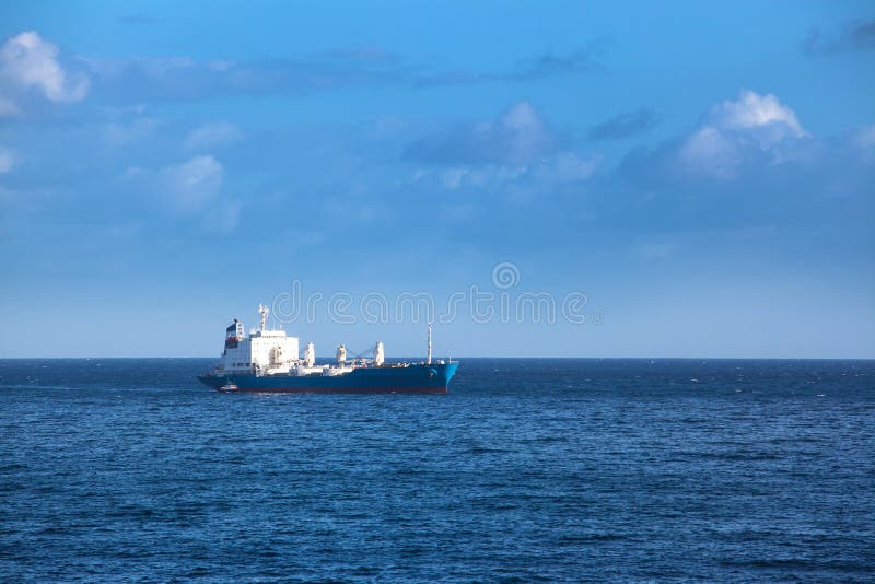 Cargo ship in the ocean stock photo. Image of seascape - 29534524