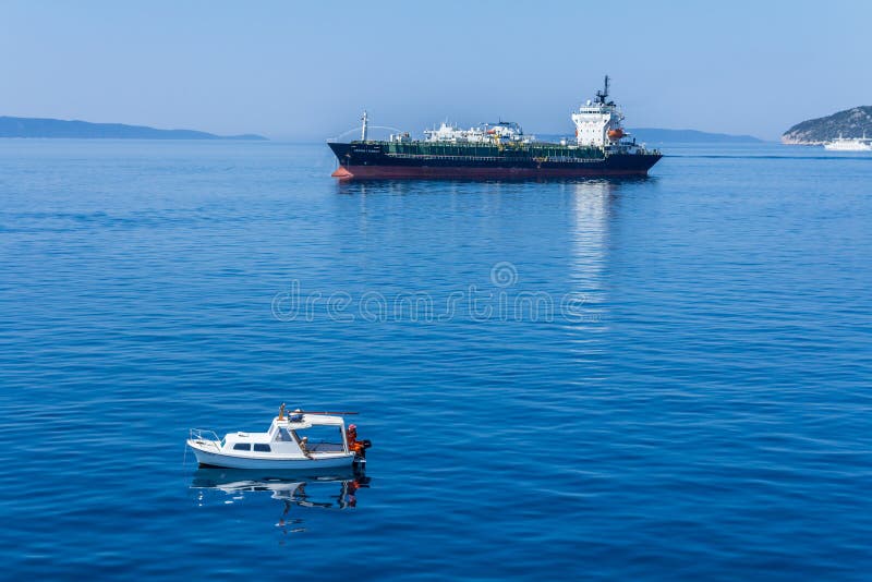 Cargo Ship Passing a Small Boat on the Adriatic Sea Editorial Image ...