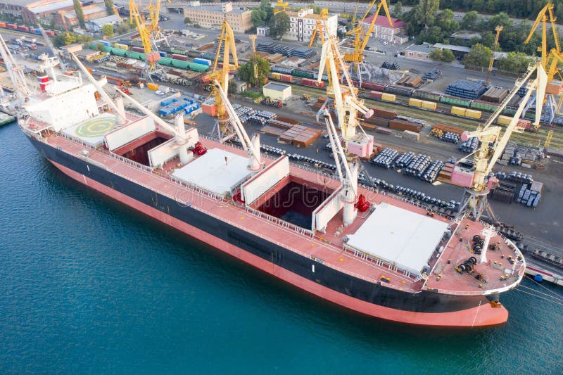 A Cargo Ship at the Pier in the Port. the Loading Process is in ...