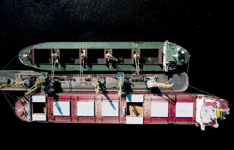 A Cargo Ship at the Pier in the Port. the Loading Process is in ...