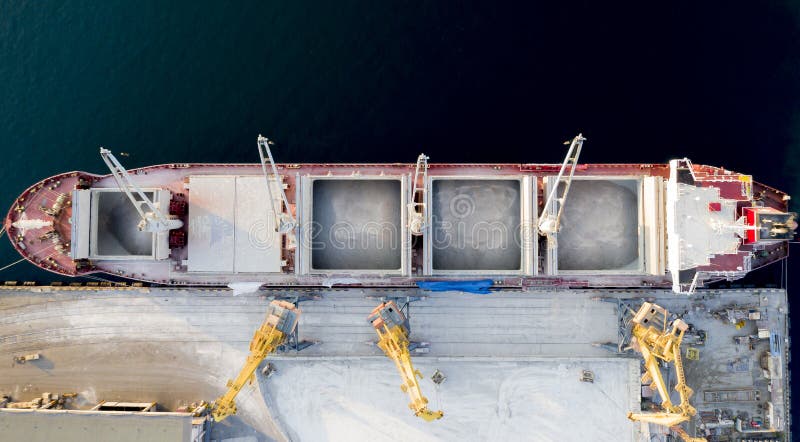 A Cargo Ship at the Pier in the Port. the Loading Process is in ...