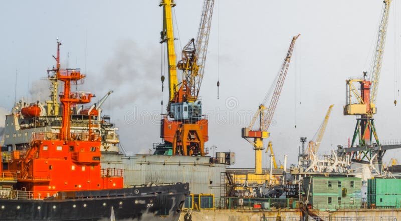 Cargo ship at the port editorial stock photo. Image of crane - 141690653