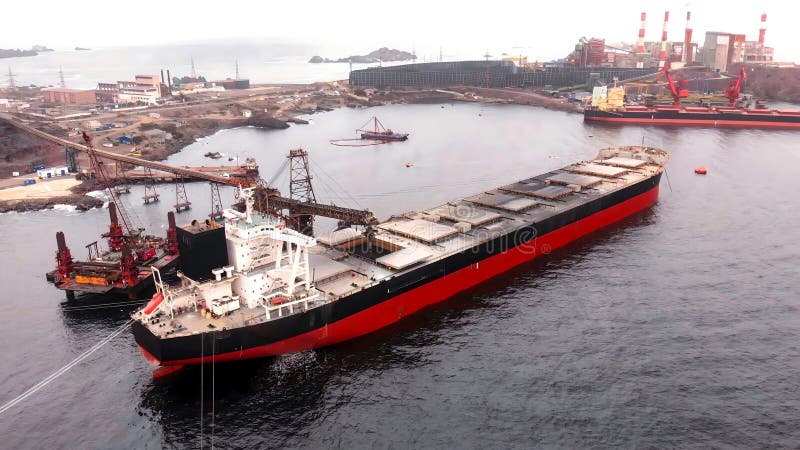 Cargo Ship in the Process of Loading Minerals from a Mine for Export ...