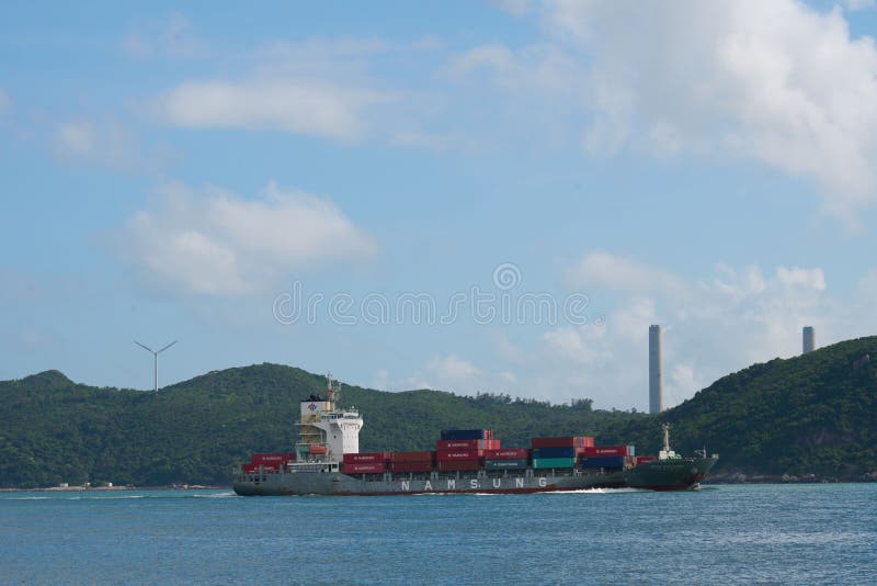 Cargo Ship Riding on Waterfall Bay Waters on the Background of a Hill ...