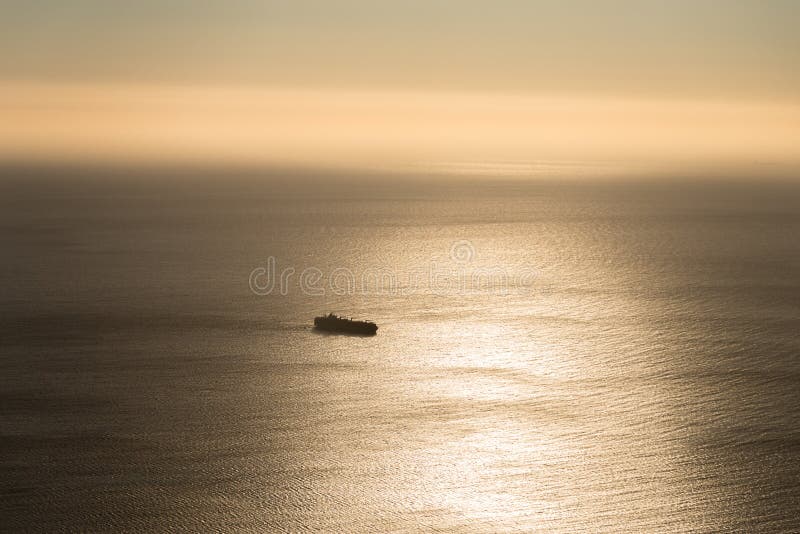 Cargo Ship Sailing in the Distance with Sunset Stock Photo - Image of ...
