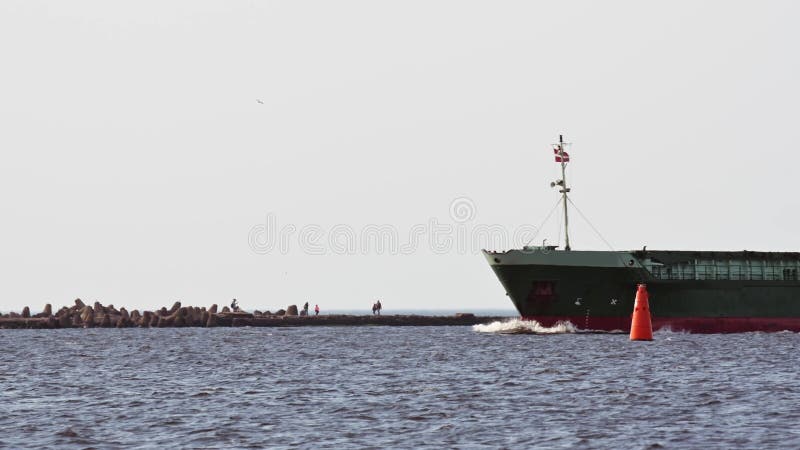 A Cargo Ship is Sailing on a Navigable River. the Ship is Transporting ...