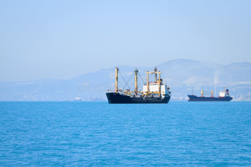 Cargo Ship Sailing in Still Water Stock Image - Image of foreign, boat ...