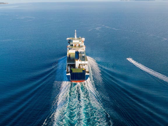 Cargo Ship at Sea, Leaving a Wake Stock Image - Image of ocean ...