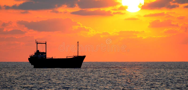 Cargo ship and sunset. stock image. Image of aged, ocean - 17825057