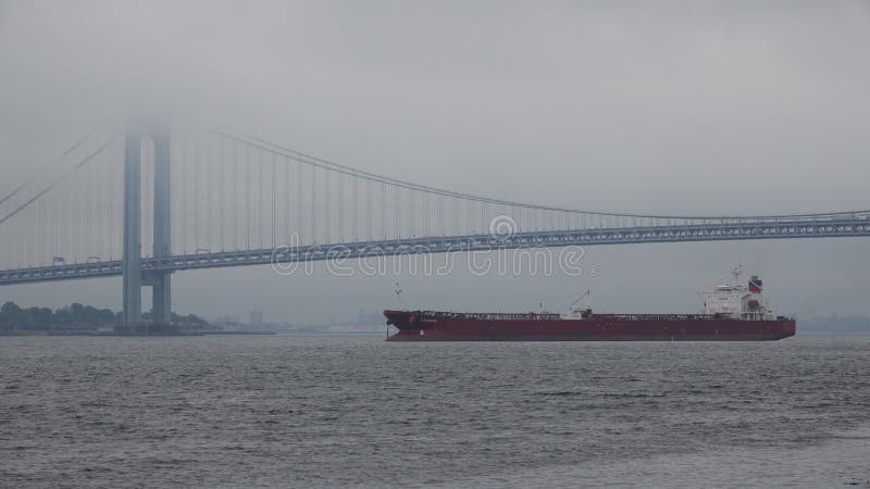 Cargo Ship and Suspension Bridge in Fog Editorial Stock Photo - Image ...
