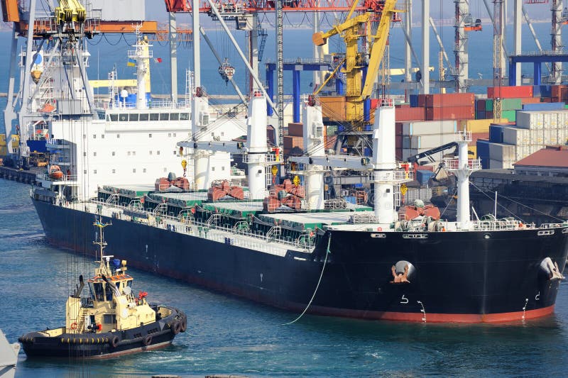 Cargo ship and tug boat stock photo. Image of industry - 25221962