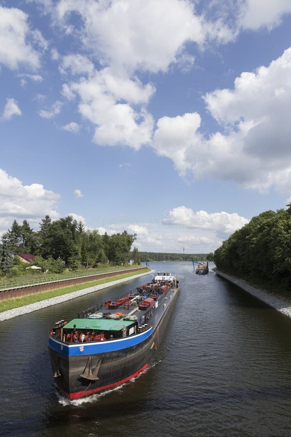 Cargo Ship Under the Bridge Editorial Image - Image of water ...