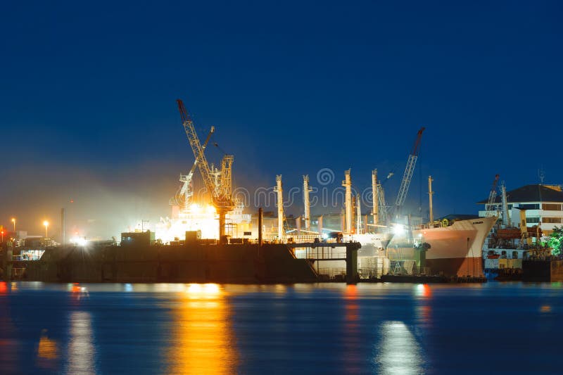 Cargo Ship Under Repair in Floating Dry Dock at Night Stock Photo ...