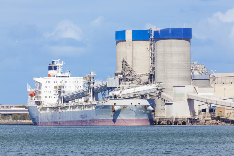 Cargo Ship Unloading at a Cement Plant Stock Photo - Image of loading ...