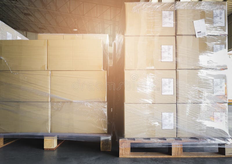 Cargo Package Boxes Loading into Shipping Cargo Container. Trucks ...