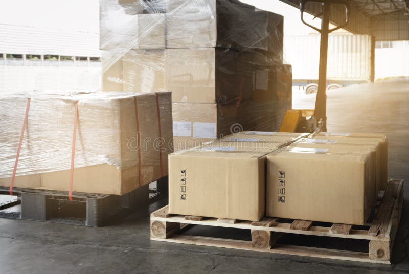 Cargo Shipment Boxes. Stack of Package Boxes Wrapping Plastic Film on ...