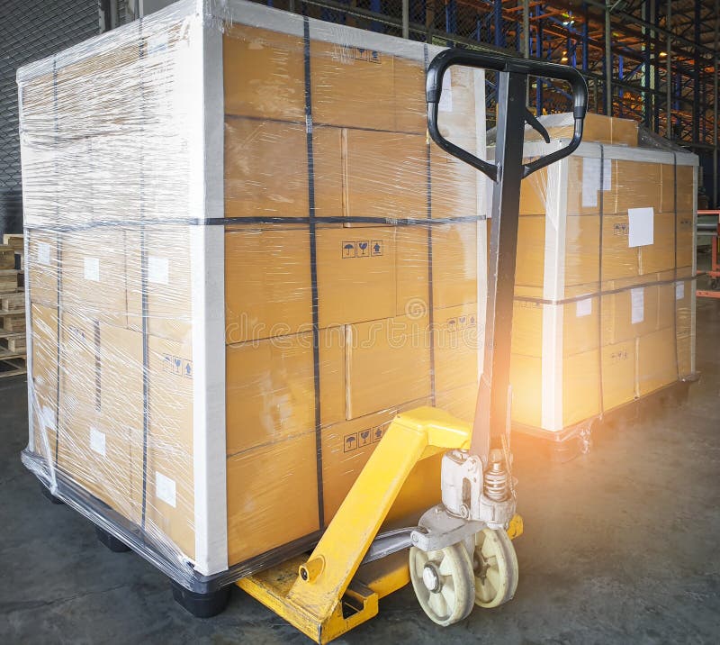 Stacked of Cardboard Boxes Wrapped Plastic on Pallet Rack. Interior of ...