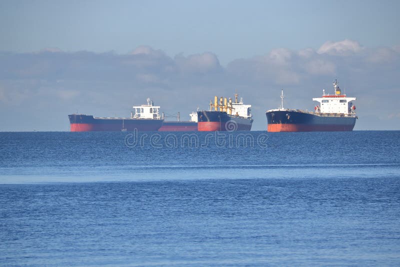 Cargo Shipping Freighters Anchored in Ocean Stock Image - Image of ...