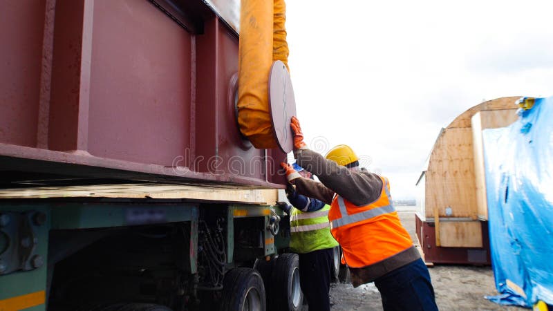 Cargo Shipping - Man Worker Fixing the Flexible Tube and Preparing the ...