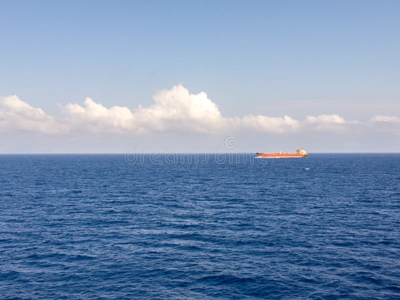Cargo Tanker Ship in the Blue Sea Stock Photo - Image of clouds, beach ...