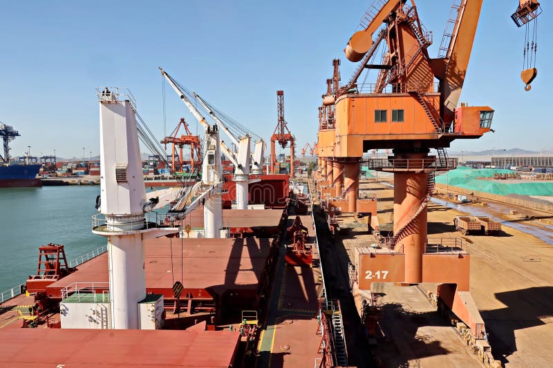 Cargo Terminal for Unloading Bulk Cargoes by Shore Cranes. Views of the ...