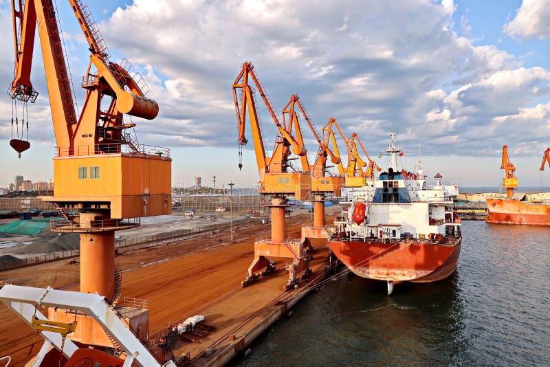 Cargo Terminal for Unloading Bulk Cargoes by Shore Cranes. Views of the ...