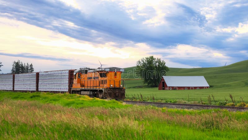 A Cargo Train Crossing through the Fields of Palouse, Washington Stock ...