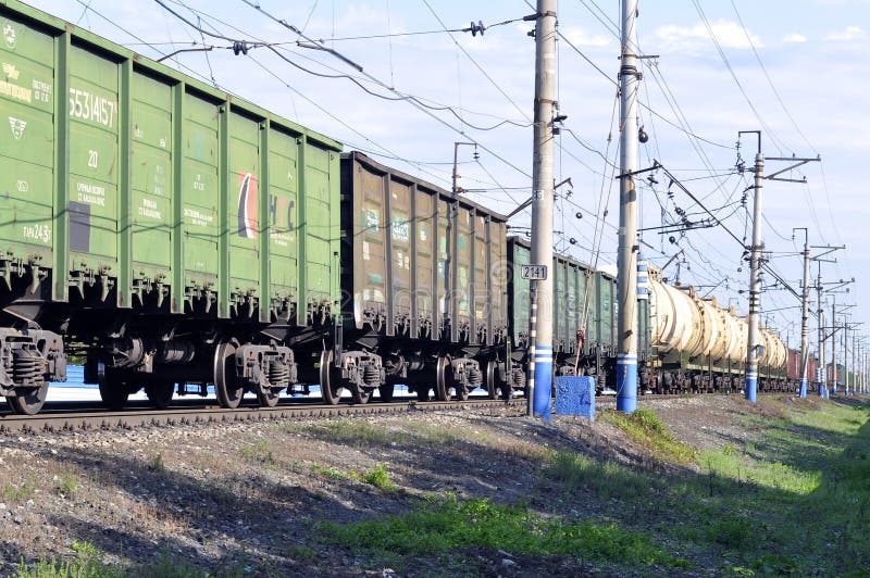 The Cargo Train on Rails in the Summer Afternoon. Editorial Stock Image ...