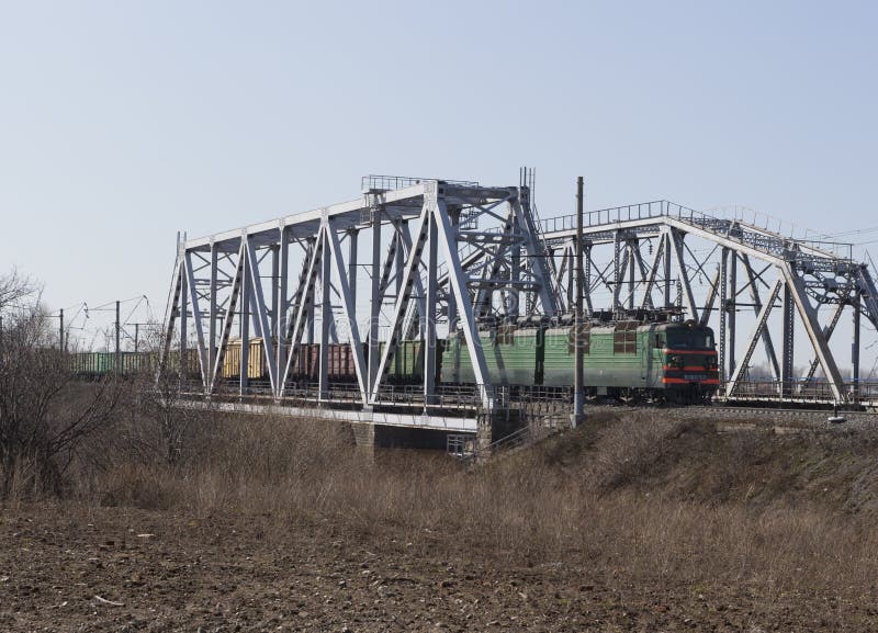 Cargo Train Rides on the Railway Bridge Editorial Stock Image - Image ...