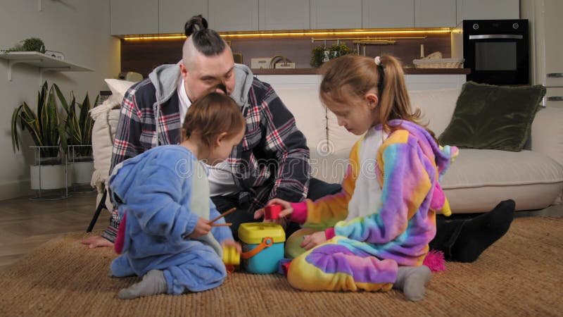 Caring Father and Two Little Daughter Playing with Shape Puzzle Match ...