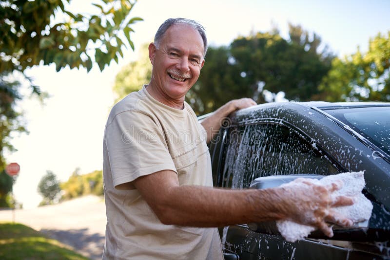 Caring for His Car. Portrait of a Man Washing a Car Outside. Stock ...