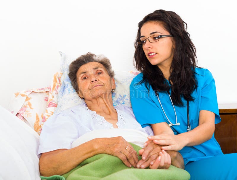Nurses Caring for Elderly Patients Stock Photo - Image of happiness ...