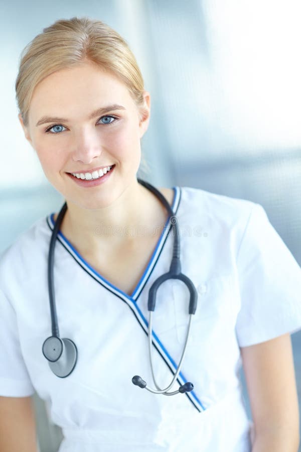 A Caring Professional. Portrait of a Pretty Nurse Who is Smiling. Stock ...